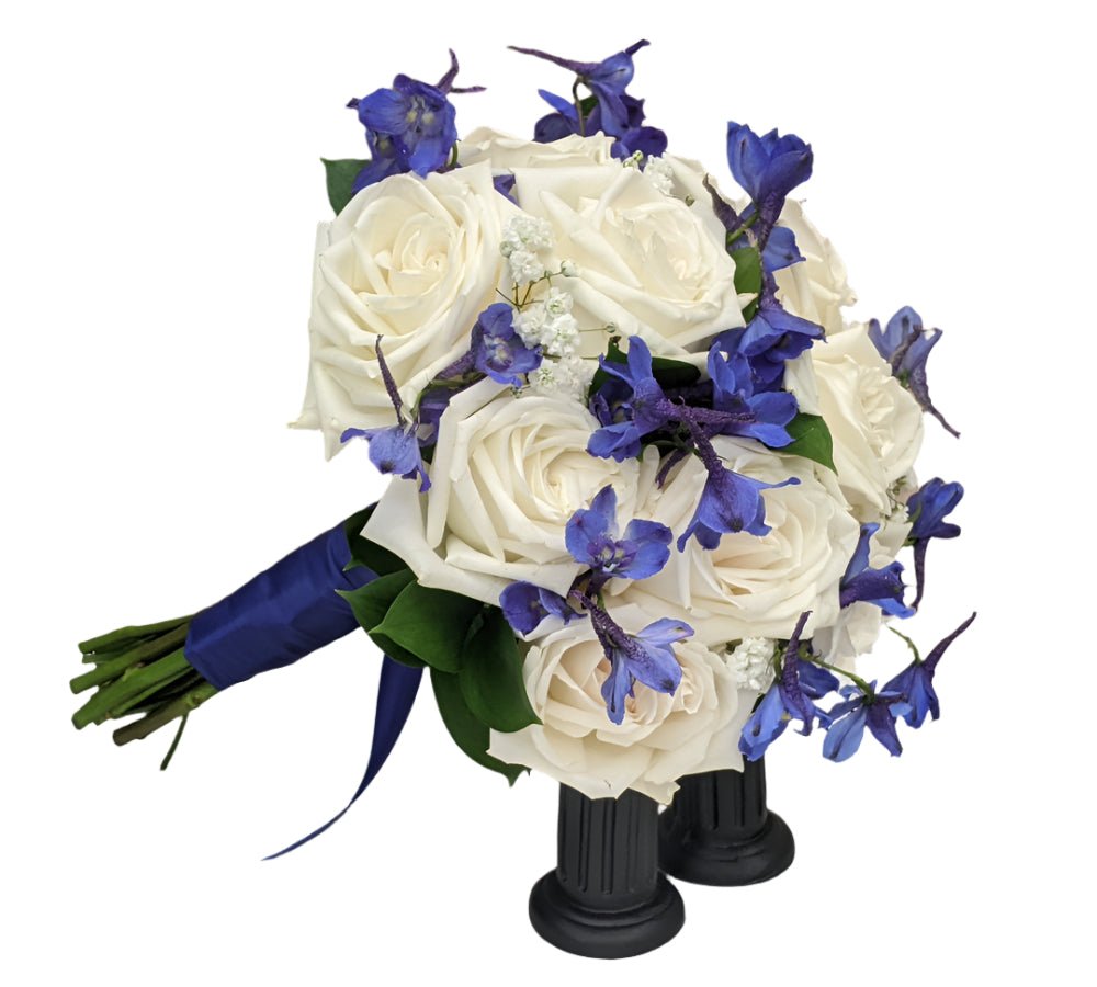 Roses and Delphinium Clutch Bouquet | Kremp Florist